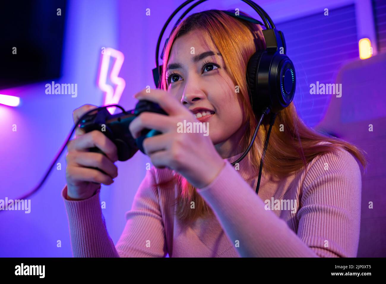 You win. Gamer using joystick controller plays online video game with ...