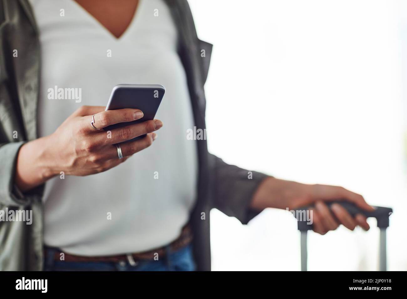 Texting people back home that I arrived safely. an unrecognizable woman ...