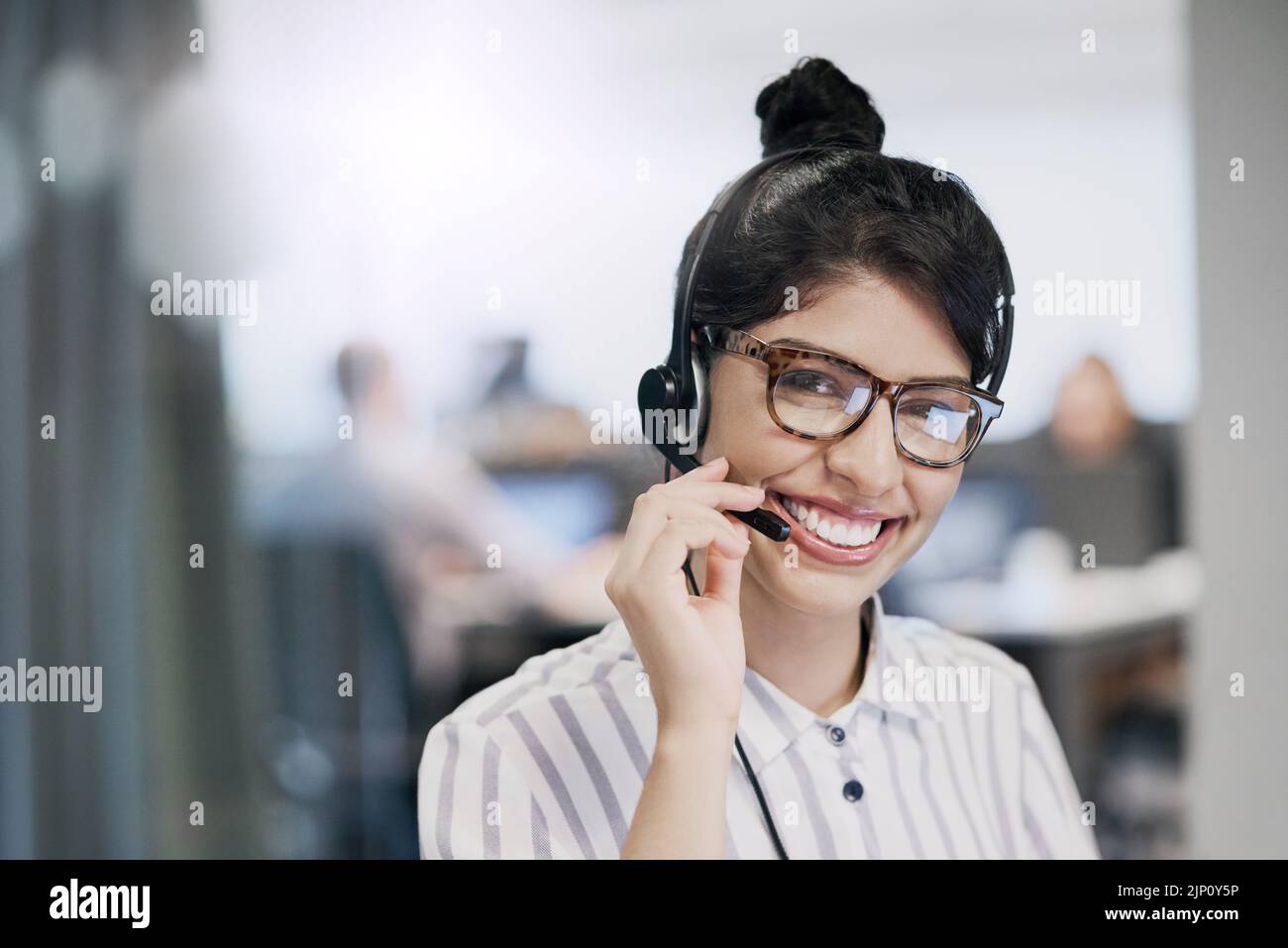 Ready to go the extra mile for any customer. Portrait of a young call ...