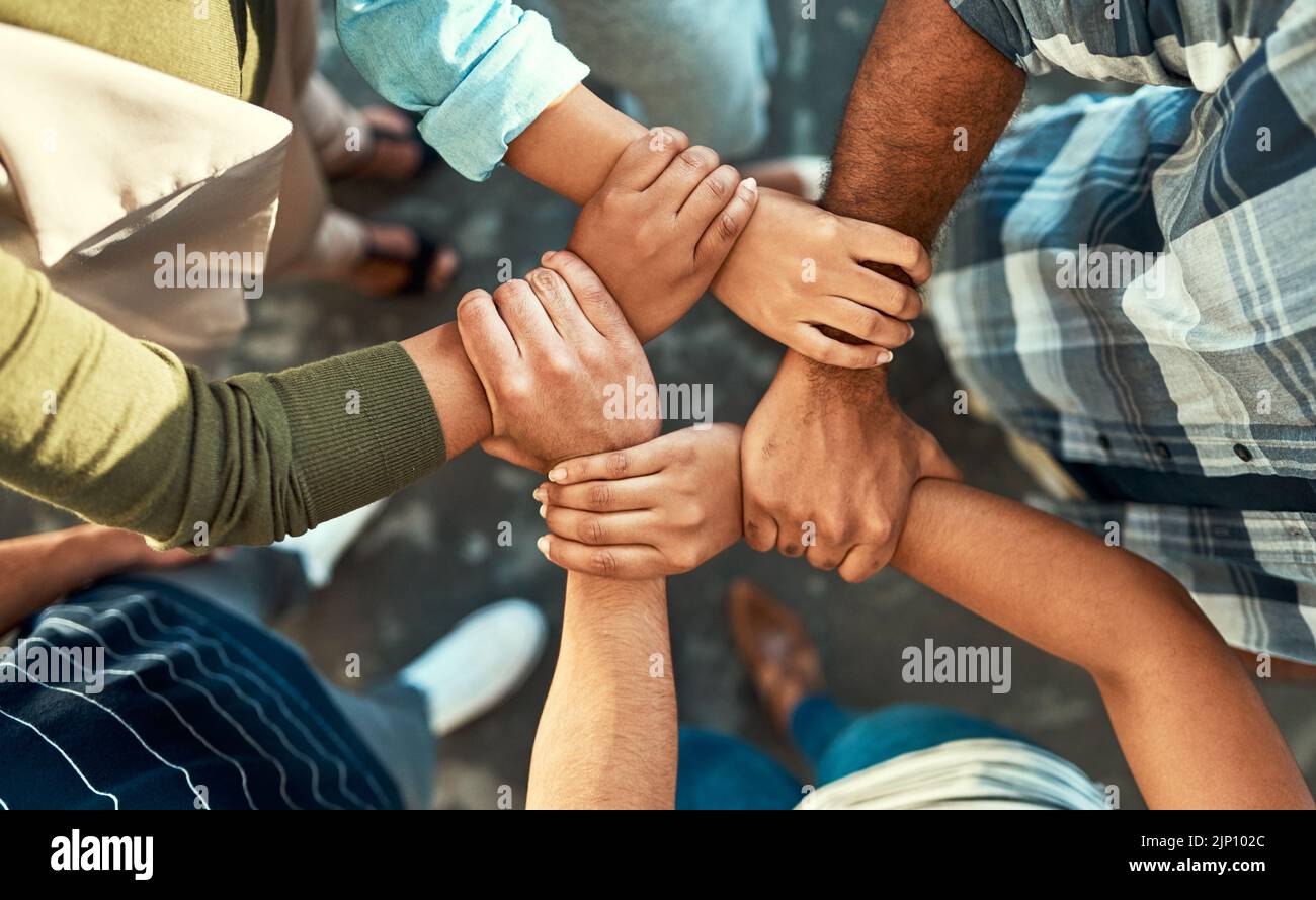 We will never let go. High angle shot of a young group of work ...
