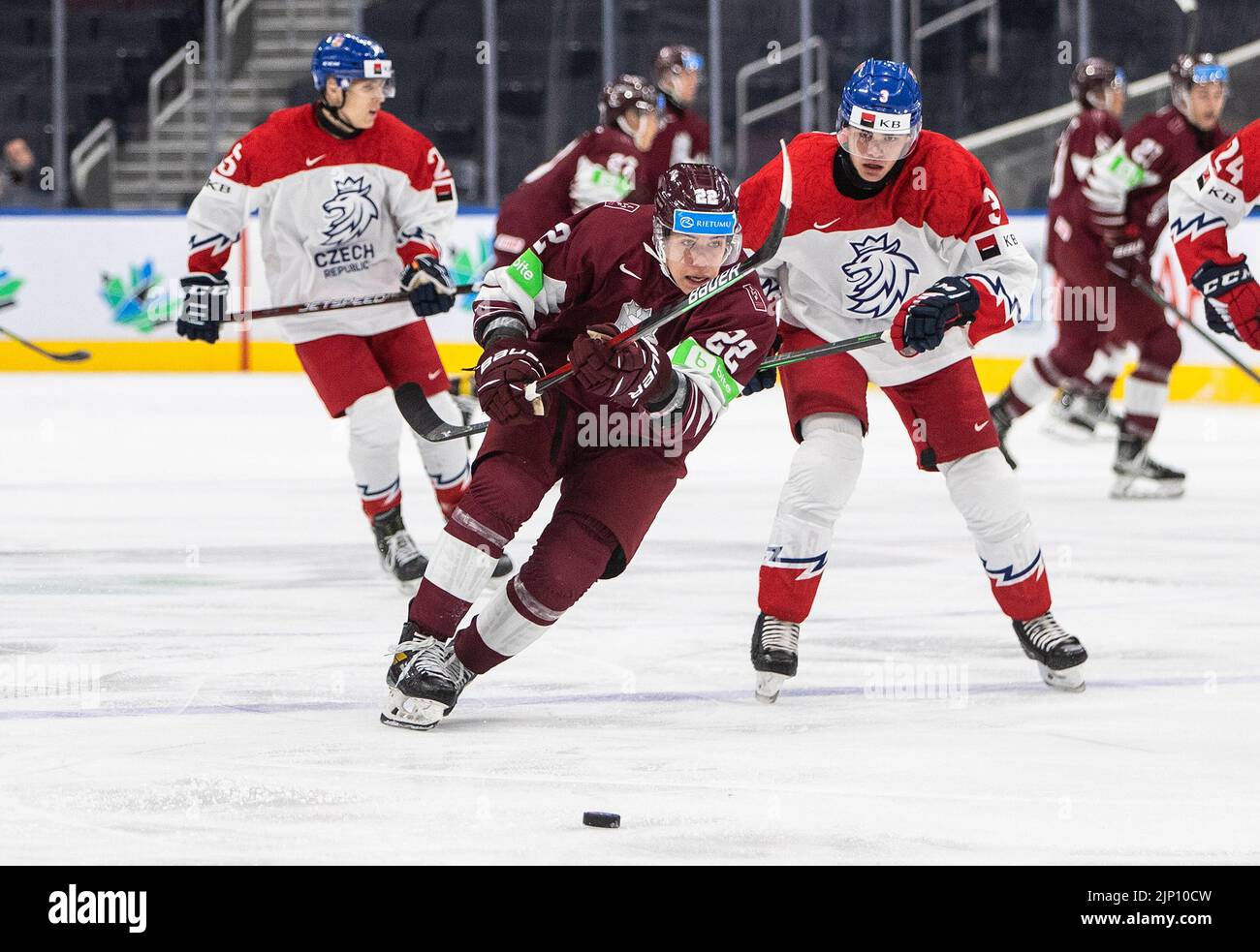 Czechia's David Spacek (3) chases Latvia's Sandis Vilmanis (22) during ...