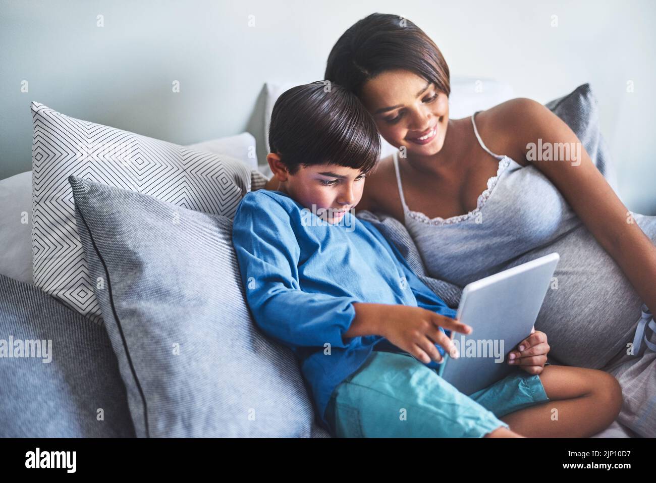 Hes a tech-savvy kid. an adorable little boy and his pregnant mother ...