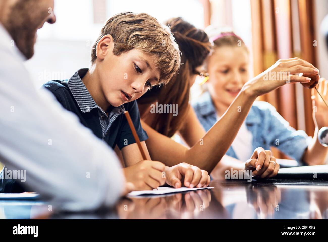 Hes definitely getting an A for effort. a little boy doing his homework ...