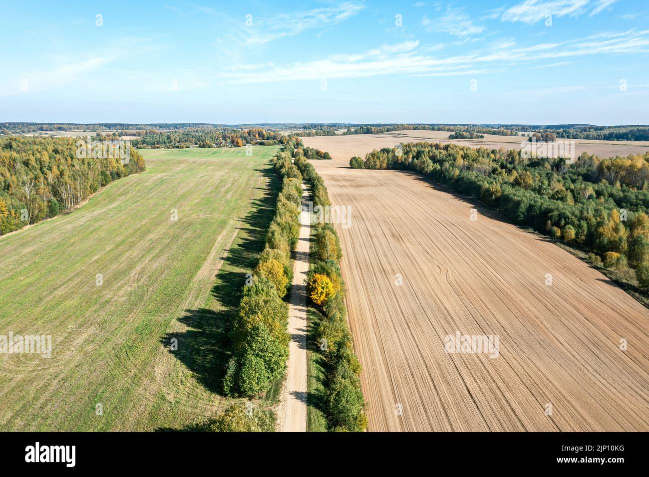 aerial view looking down on a rural dirt road in the countryside. rural ...