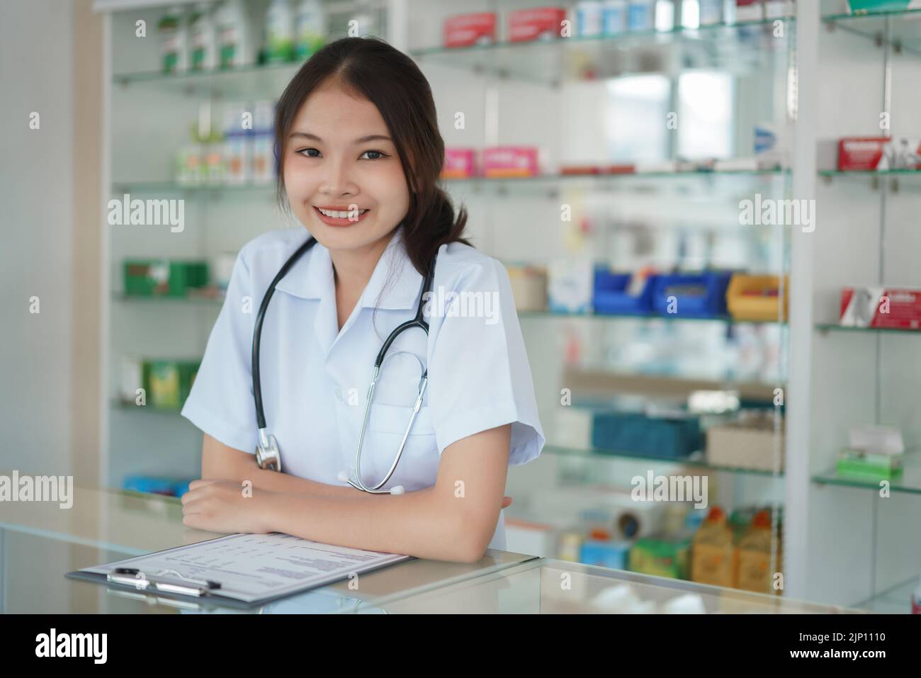 Medicine and health concept, Female pharmacist stand with crossed arms ...