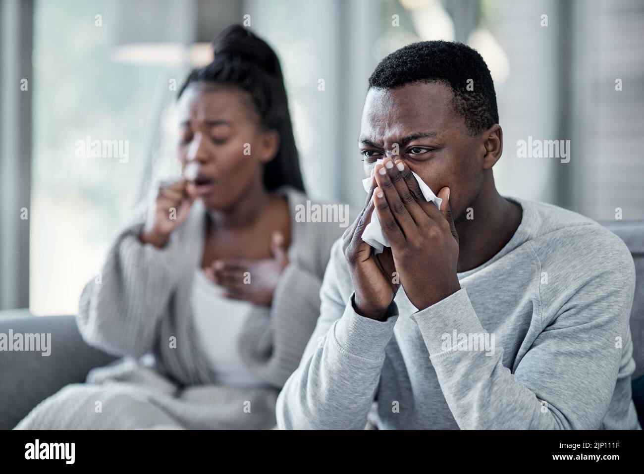 Flu, cold or sick couple with covid coughing, sneezing and blowing ...