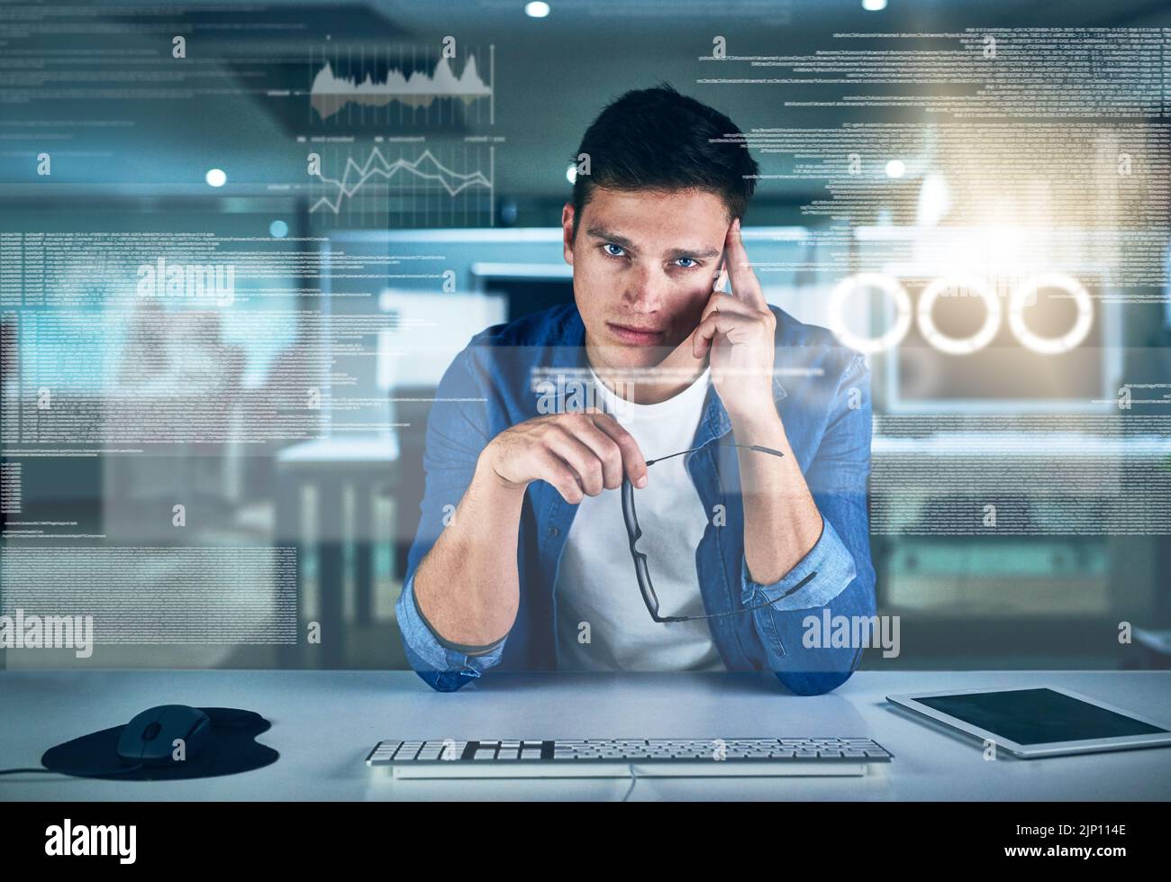 Always a busy man. a focused young programmer working on his computer ...
