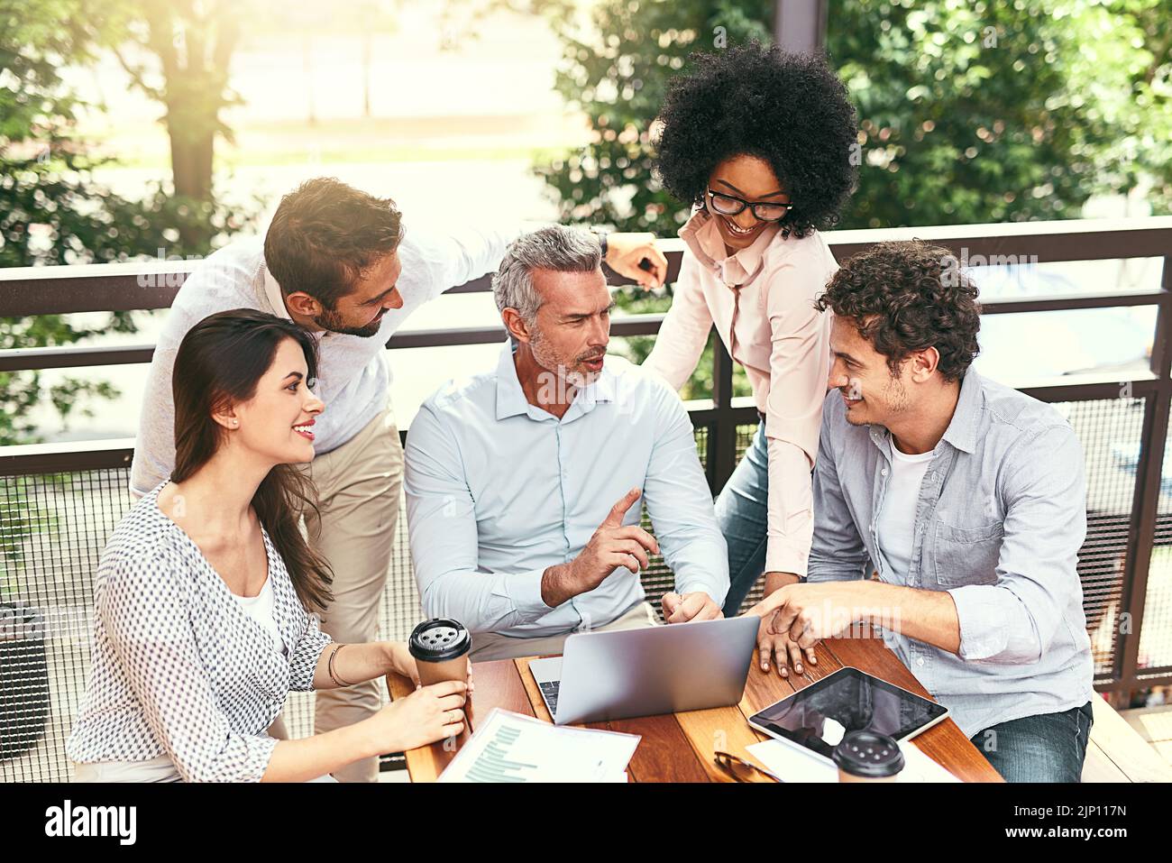 Experience is the best teacher. a team of colleagues using a laptop ...