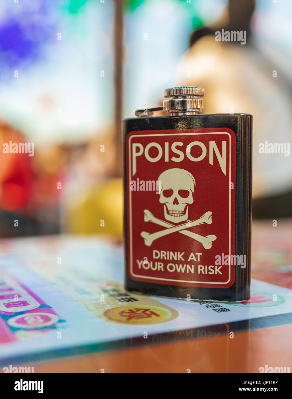 Scull with crossbones on the stainless steel flask. Poison Bottle ...