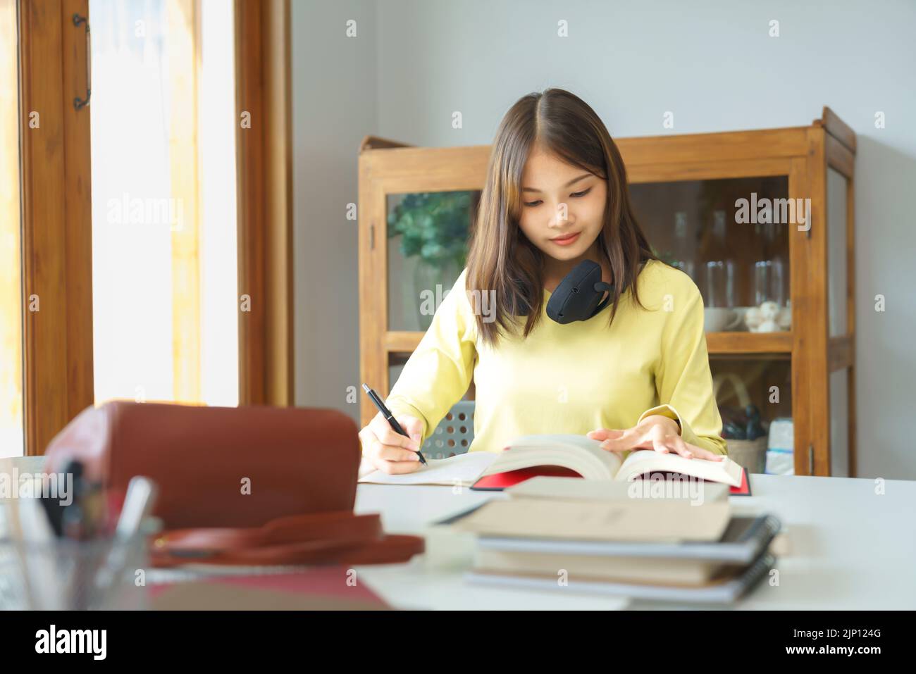 Education and literacy concept, College student girl reading textbook ...