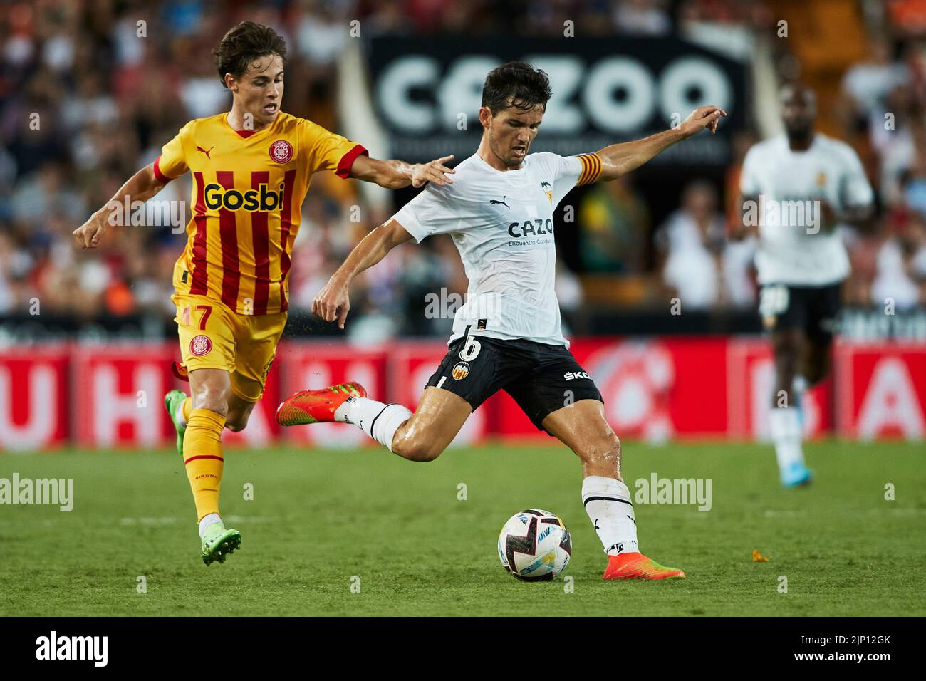 Hugo Guillamon of Valencia CF and Rodrigo Riquelme of Girona FC Stock ...