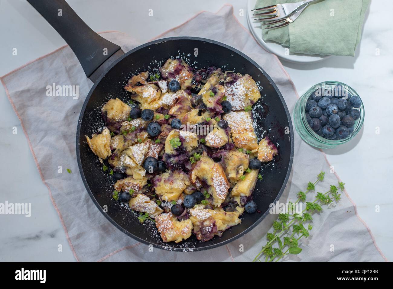 Kaiserschmarrn - traditional austrian pancake dessert with blueberries ...
