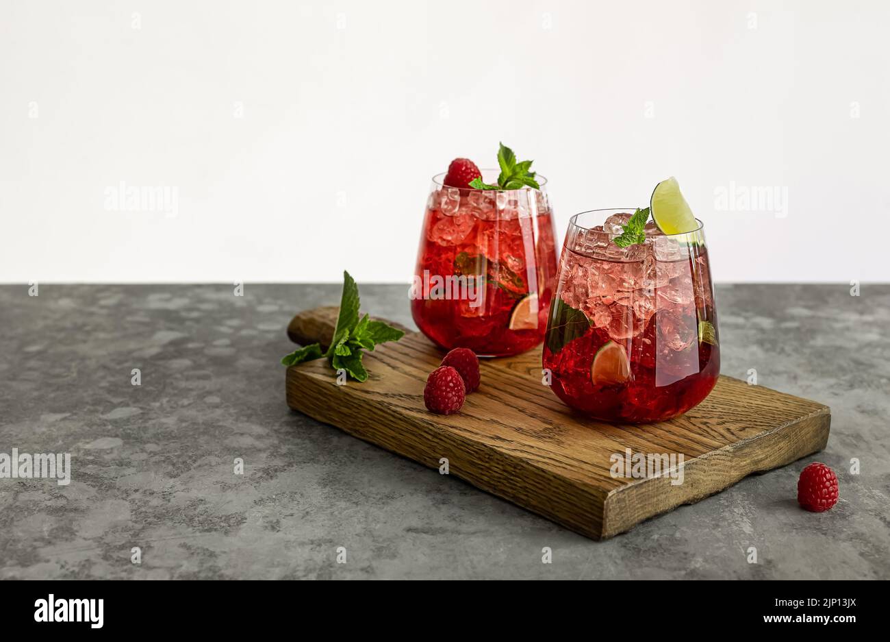 Bourbon or rum raspberry smash cocktail with lime and mint. Refreshing ...