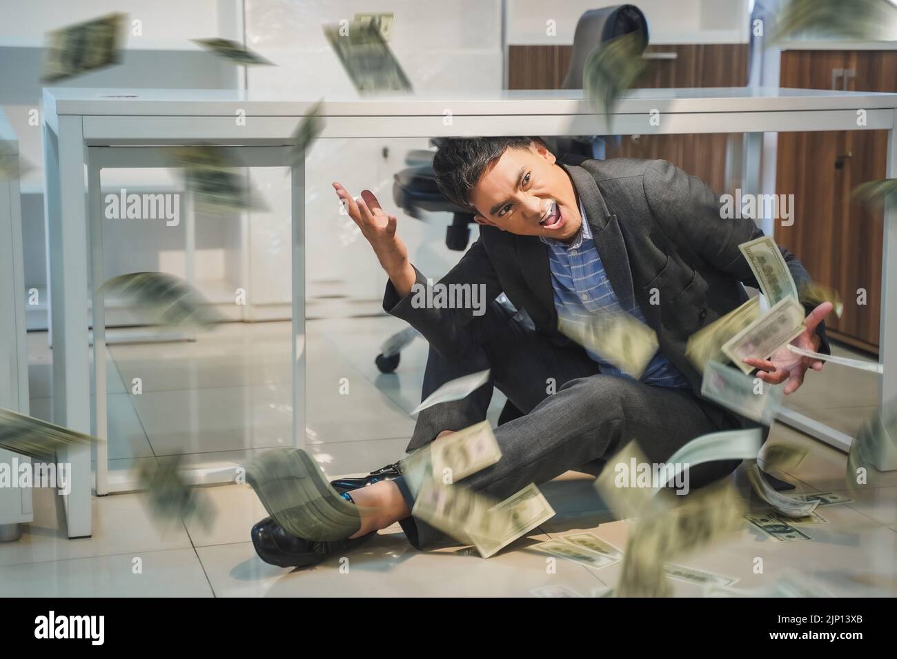business man crazy about money concept business cash money falling ...