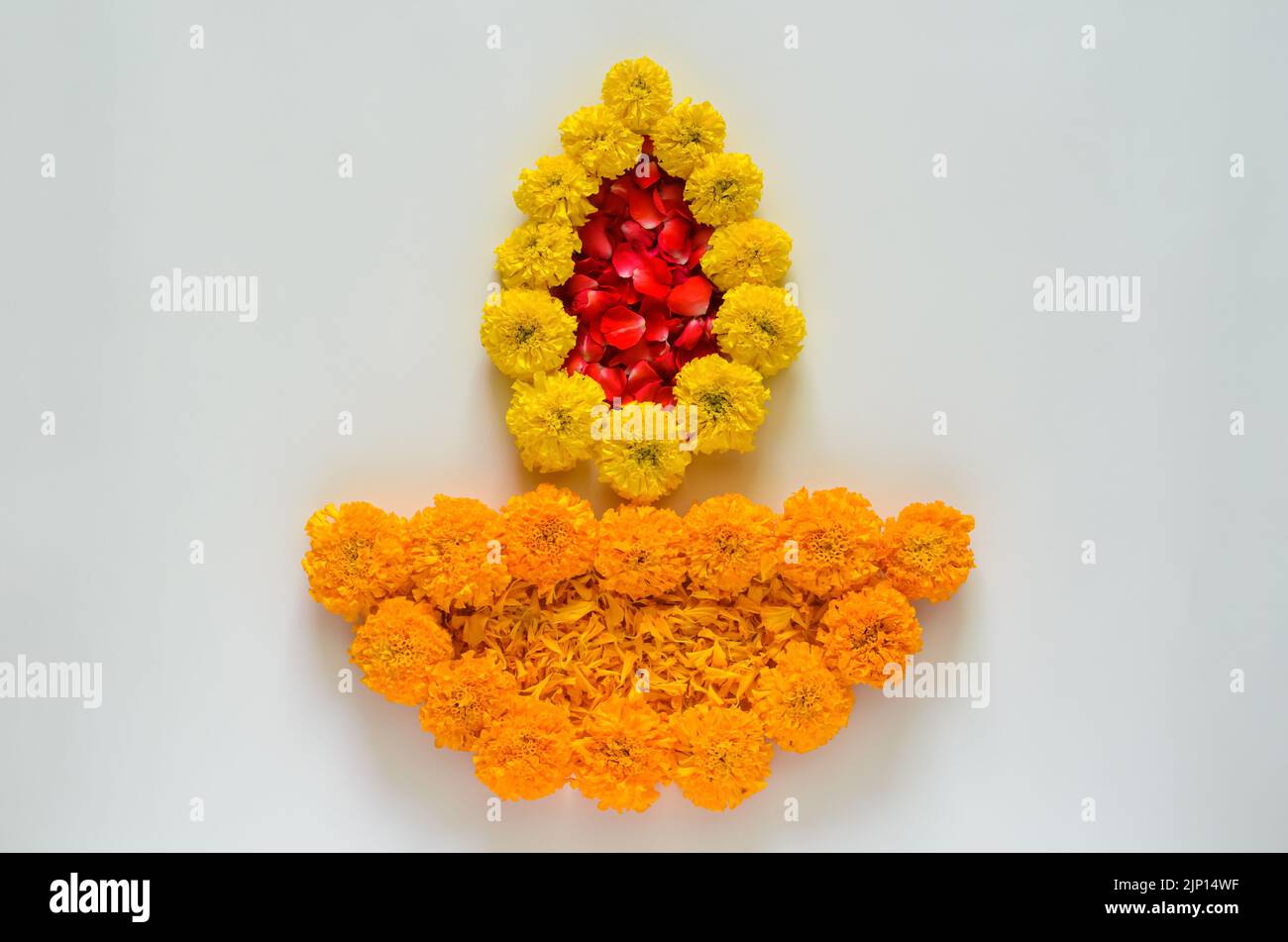 Decorative marigold flowers and rose petals rangoli for Diwali festival ...