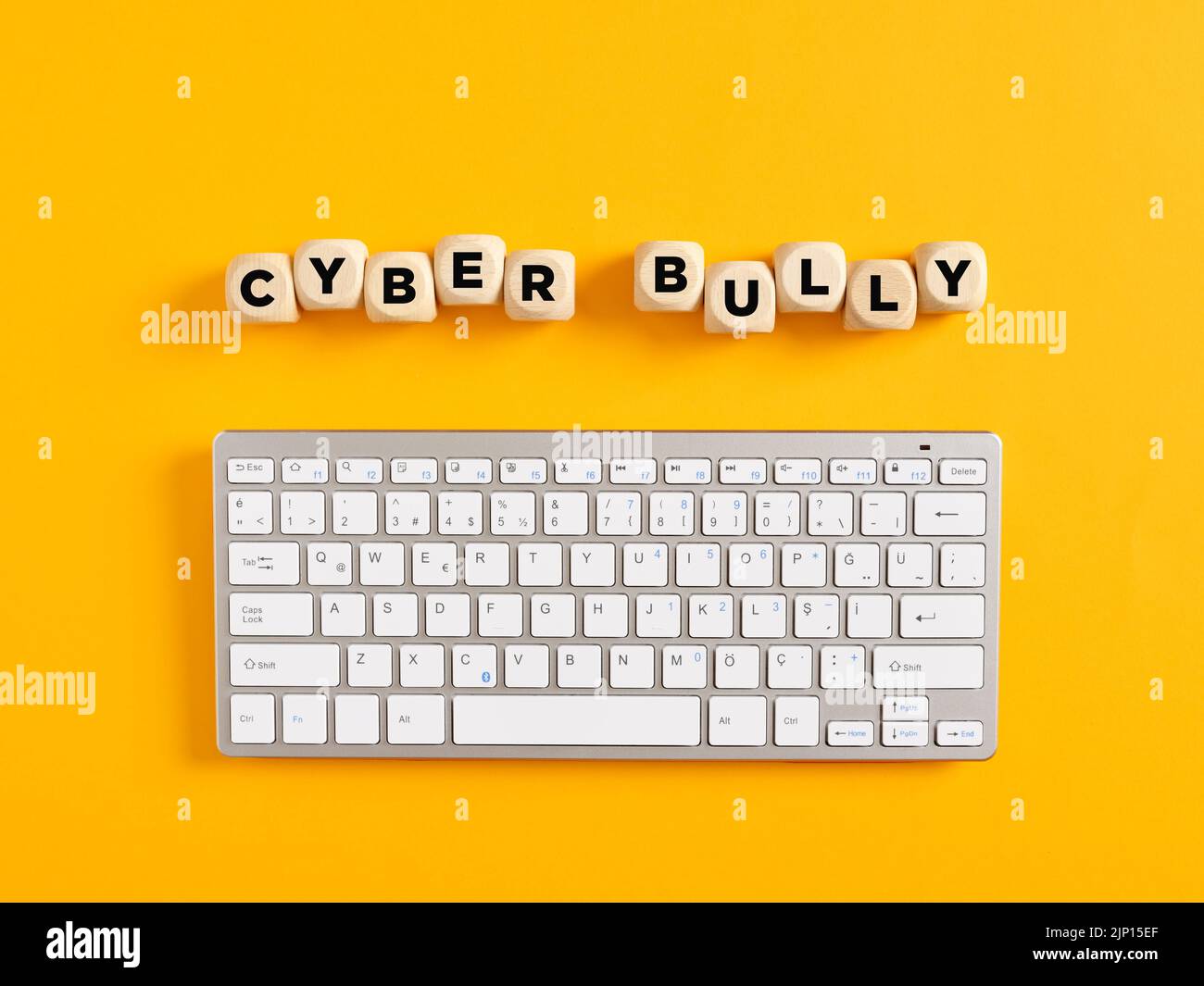The word cyber bully with computer keyboard on yellow background. Cyber ...