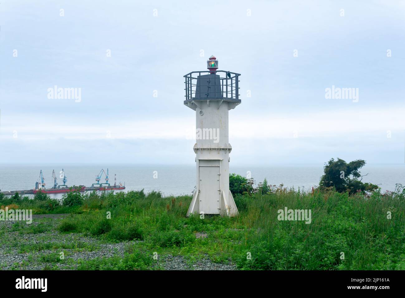 automatic lighthouse with sector light on a high cape above the sea ...