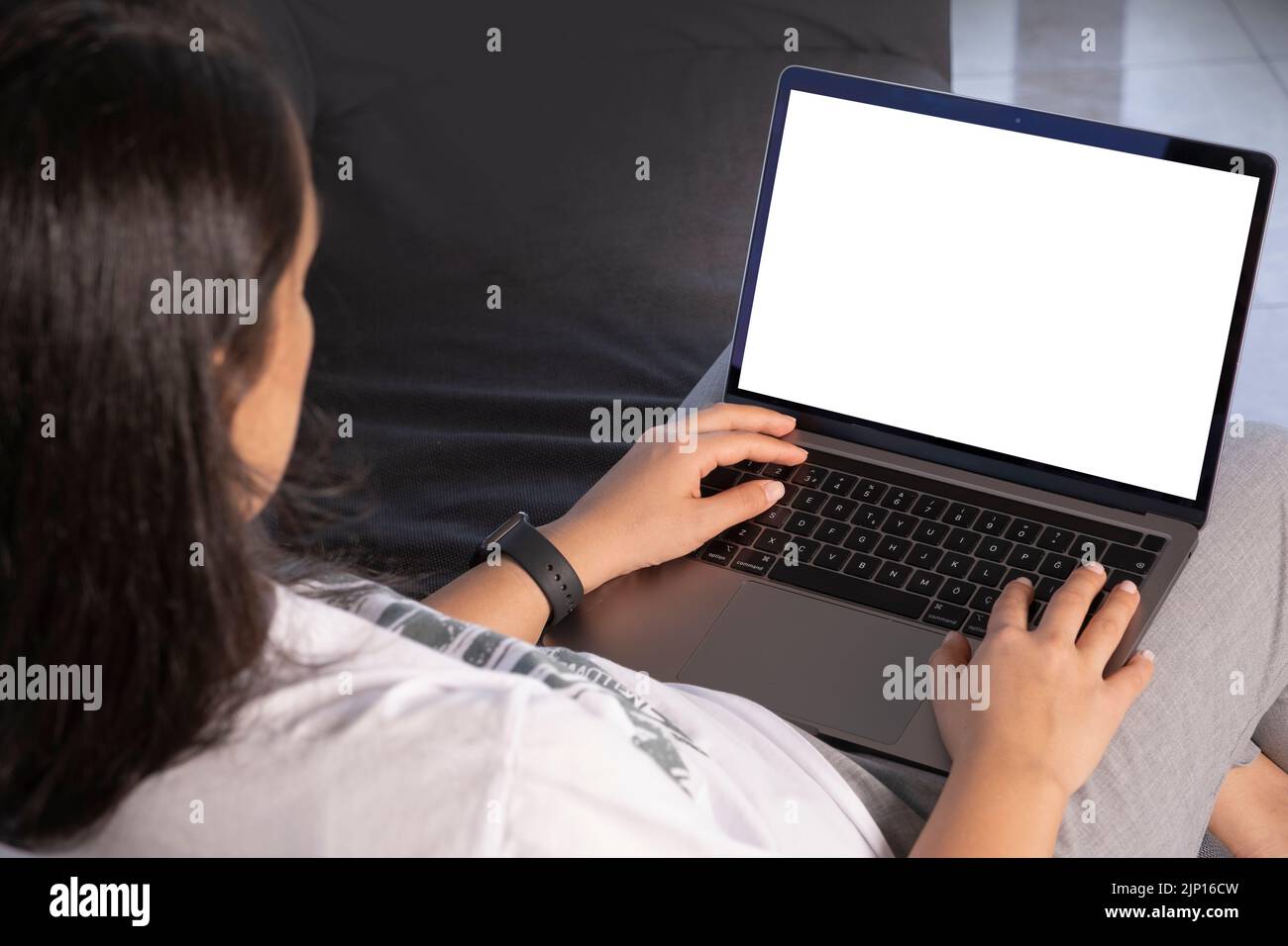 Modern laptop mock up, over shoulder view of woman holding modern ...