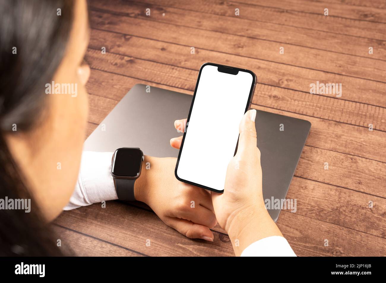 Woman holding smartphone, over shoulder view of woman holding ...
