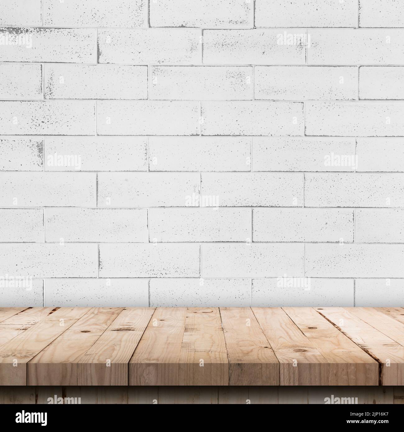 Empty wooden table top and white brick wall and rough crack background ...