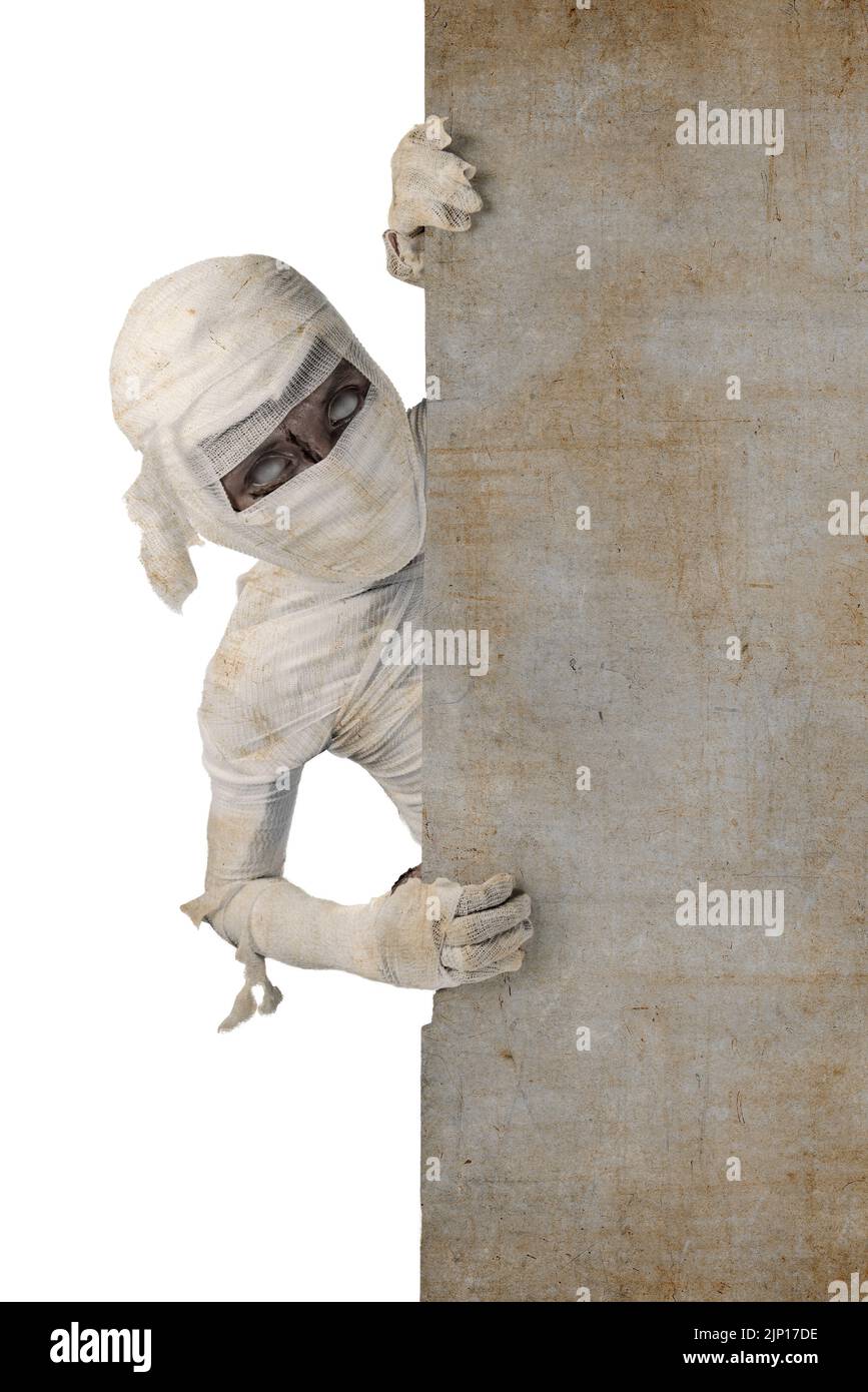 Mummy coming from behind the wall isolated over white background Stock ...