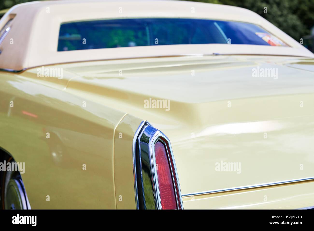 Back view of beige vintage car on exhibition. Classic american retro ...