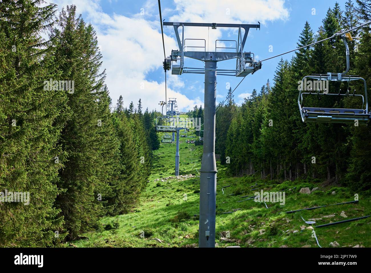 Beautiful mountains, covered with forest and open cable car line ...