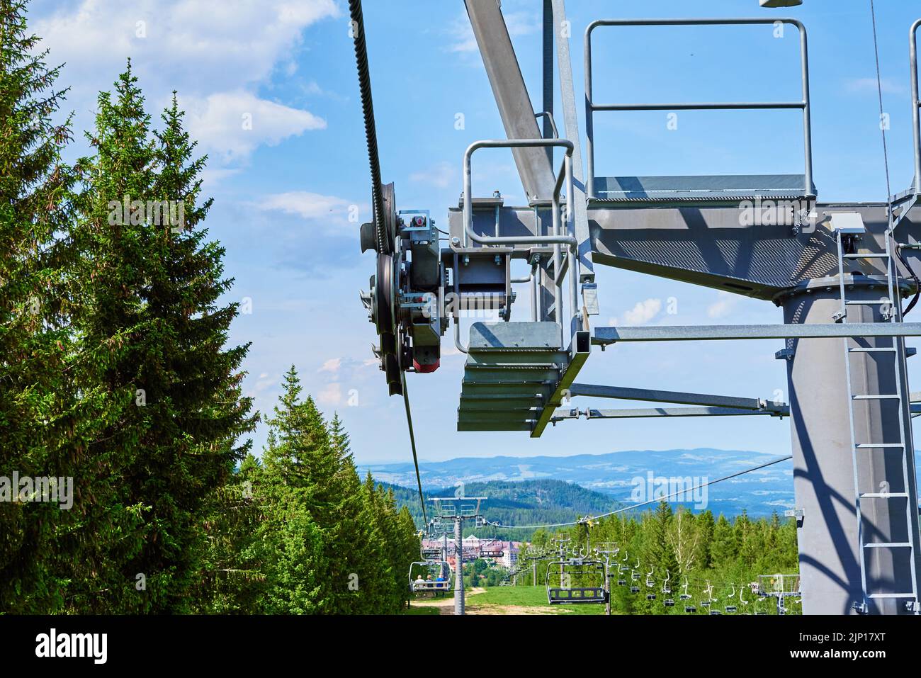 Open cable car line. Metal cable and moving rollers on platform for ...