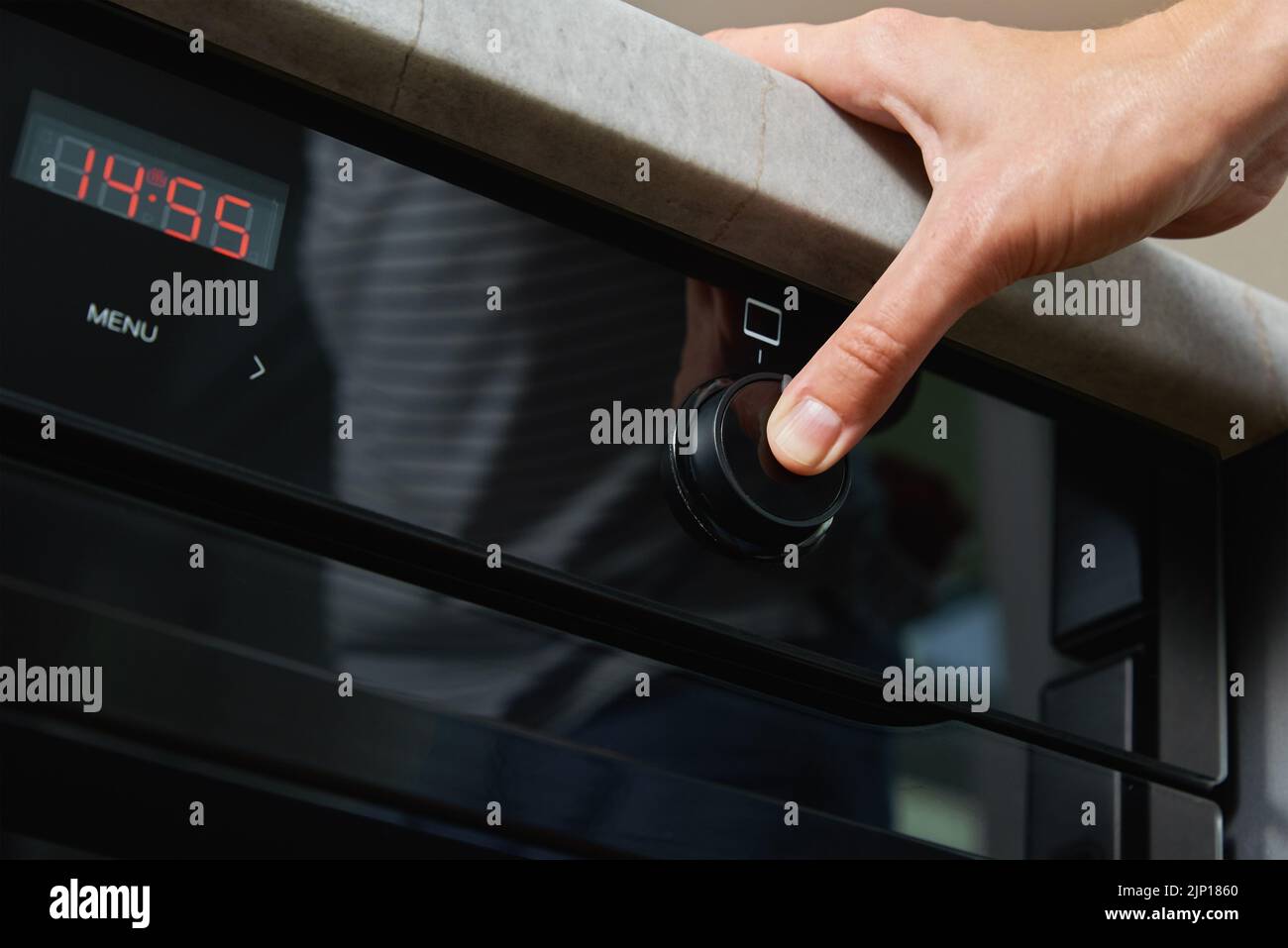 Female hand choose baking program on electric oven control panel, Woman ...