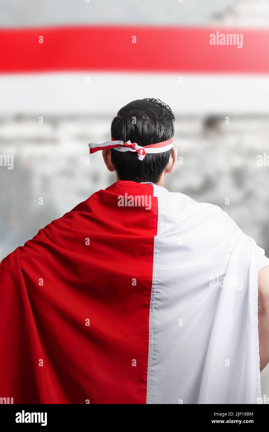Rear view of Indonesian men celebrating Indonesian independence day on ...