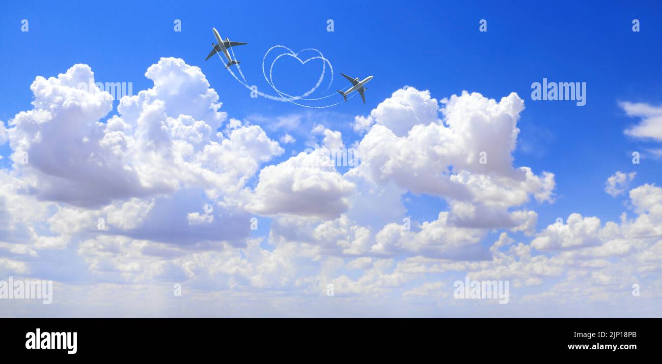 Horizontal nature background with two aircrafts draw a heart in the sky ...