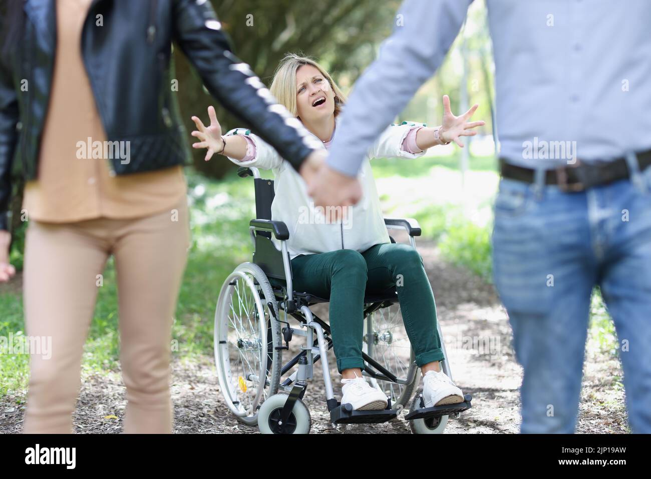 Disabled woman in wheelchair screaming or crying Stock Photo - Alamy