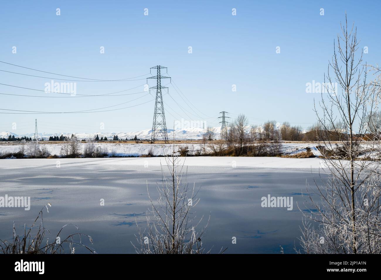 High voltage transmission towers and powerlines among hoar frost, Twizel, South Island Stock ...