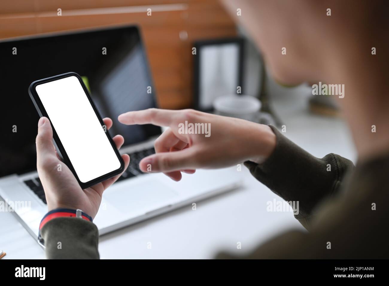 Man hand typing text message, chatting online on his mobile phone. Over ...