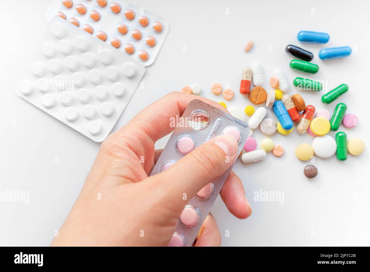 The hand chooses a pill from a sticker Stock Photo - Alamy