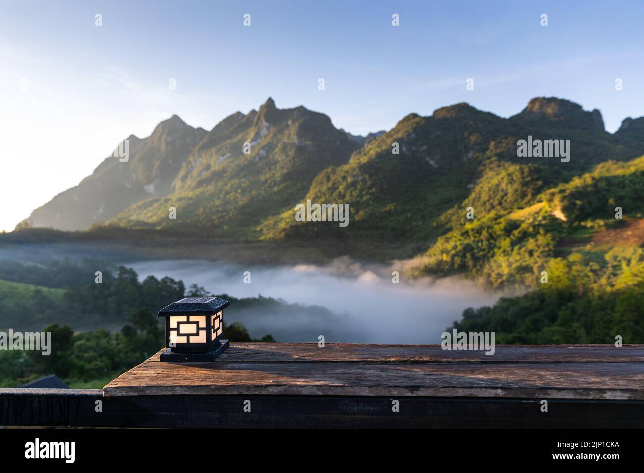 Relax corner of with lamp on wooden table with blurry background of ...