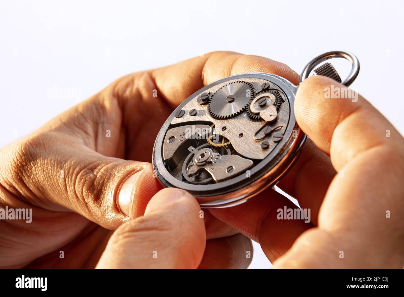Watchmaker's job. Closeup male hands holding mechanical watches ...