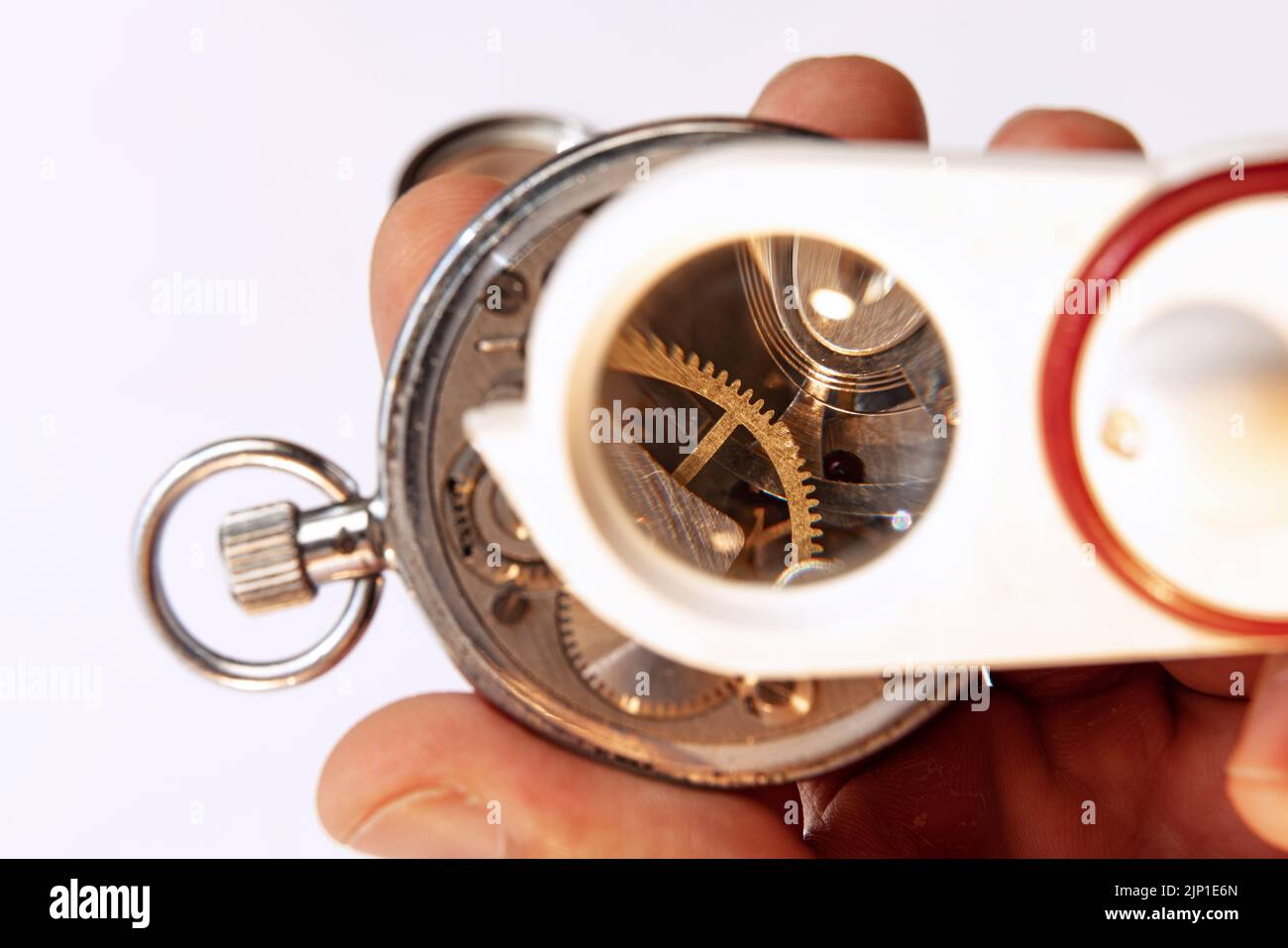 Use of special equipment for watch repair. Closeup watchmaker's hands ...