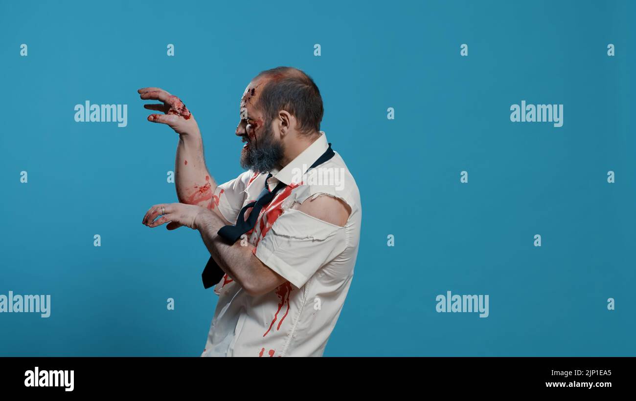 Scary looking brain-eating doing a funny dance on blue background ...