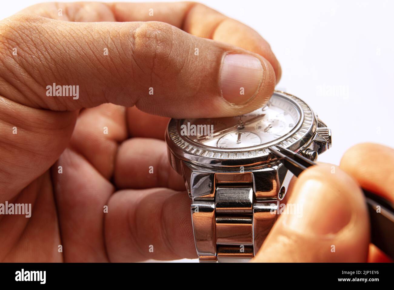 Watchmaker's job. Closeup male hands holding mechanical watches ...