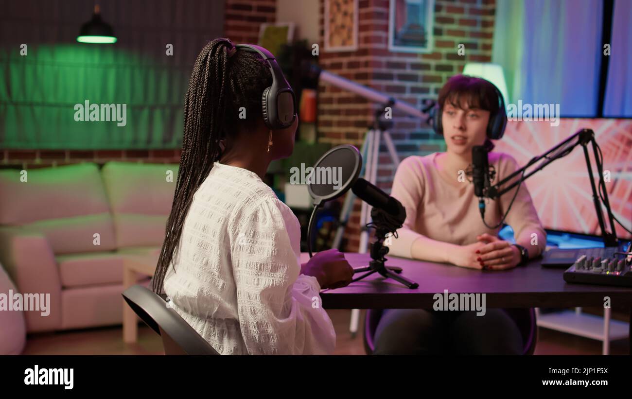 African american influencer talking in interview with smiling online ...