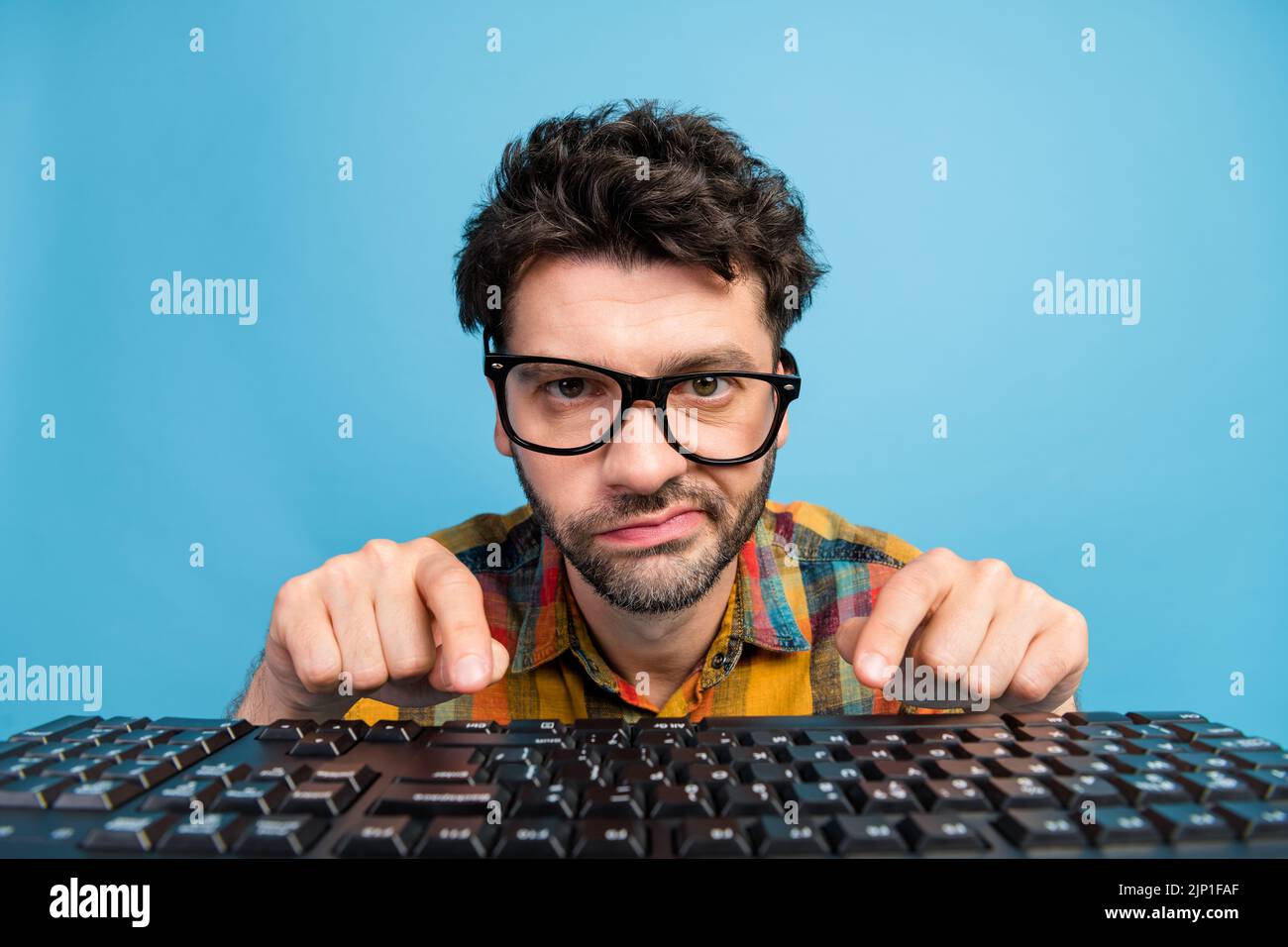 Photo of unhappy brunet guy type keyboard wear eyewear plaid shirt ...