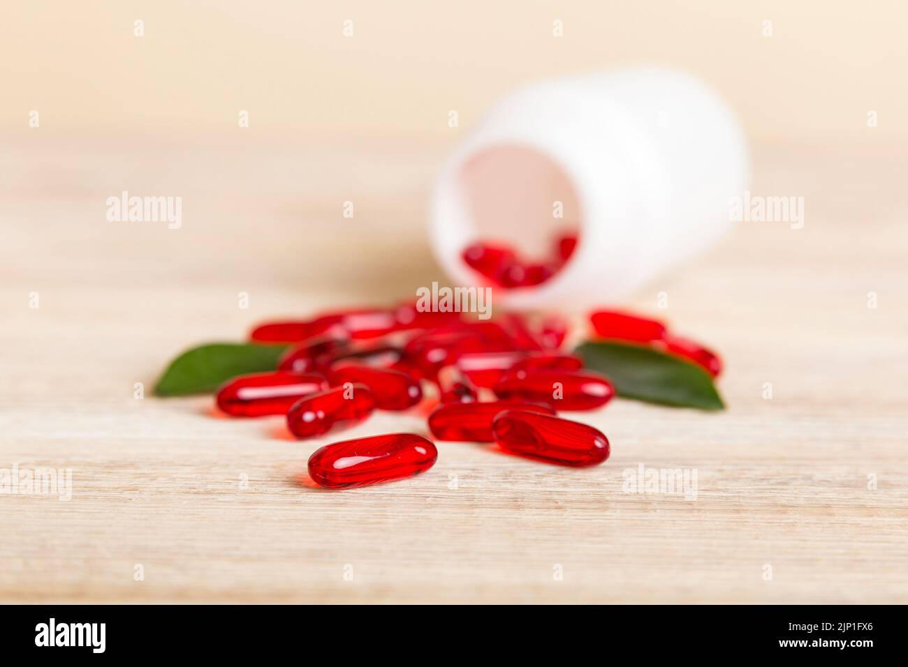 Red pills spilled around a pill bottle. Medicines and prescription ...