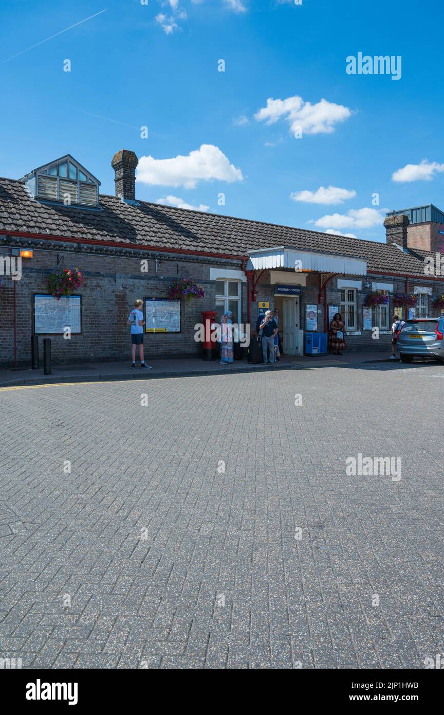 People standing outside Amersham London Underground and National Rail ...