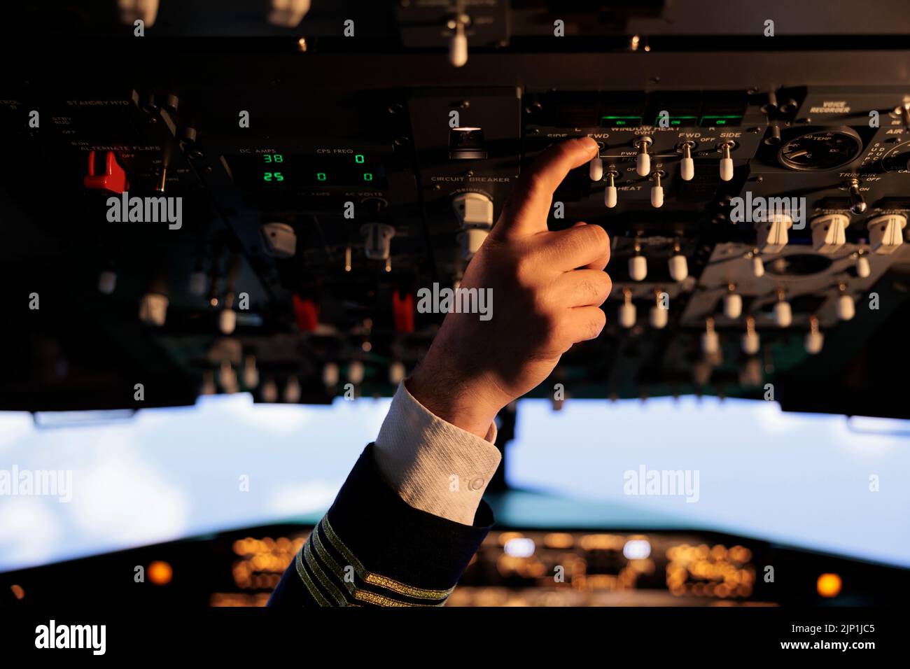 Hand of captain pushing dashboard buttons on control panel command to ...