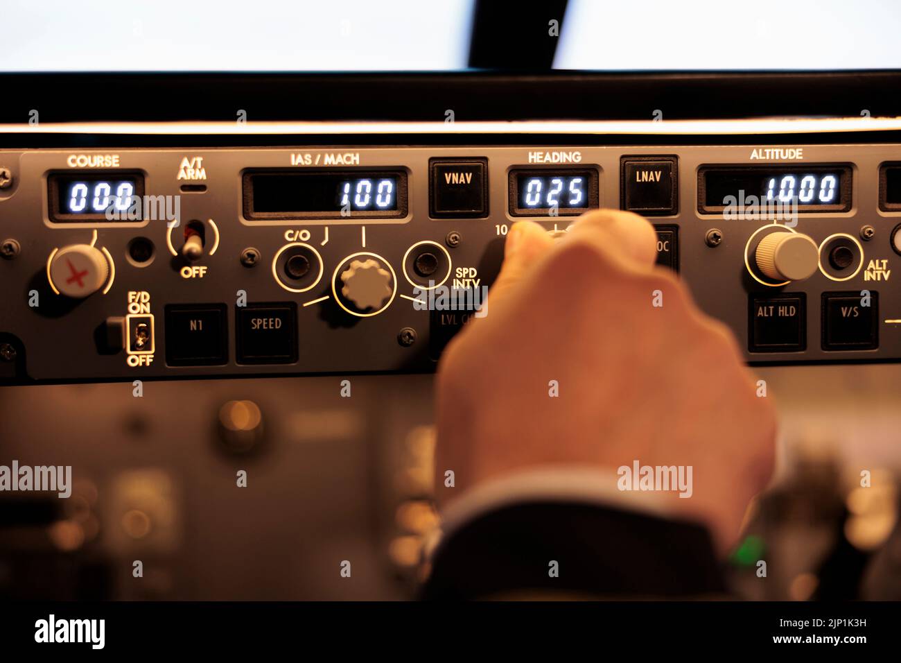 Pilot aviator fixing altitude and longitude level on dashboard in plane ...