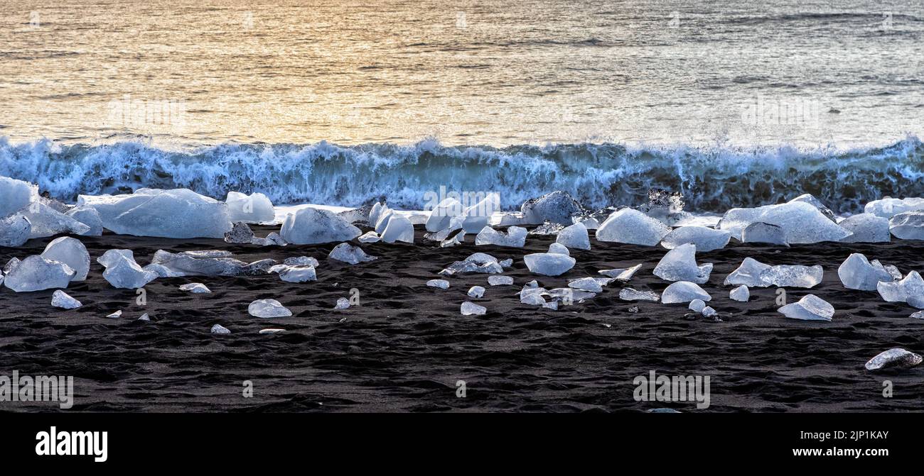 Sunrise on Diamond Beach, Iceland. The black volcanic sands are ...