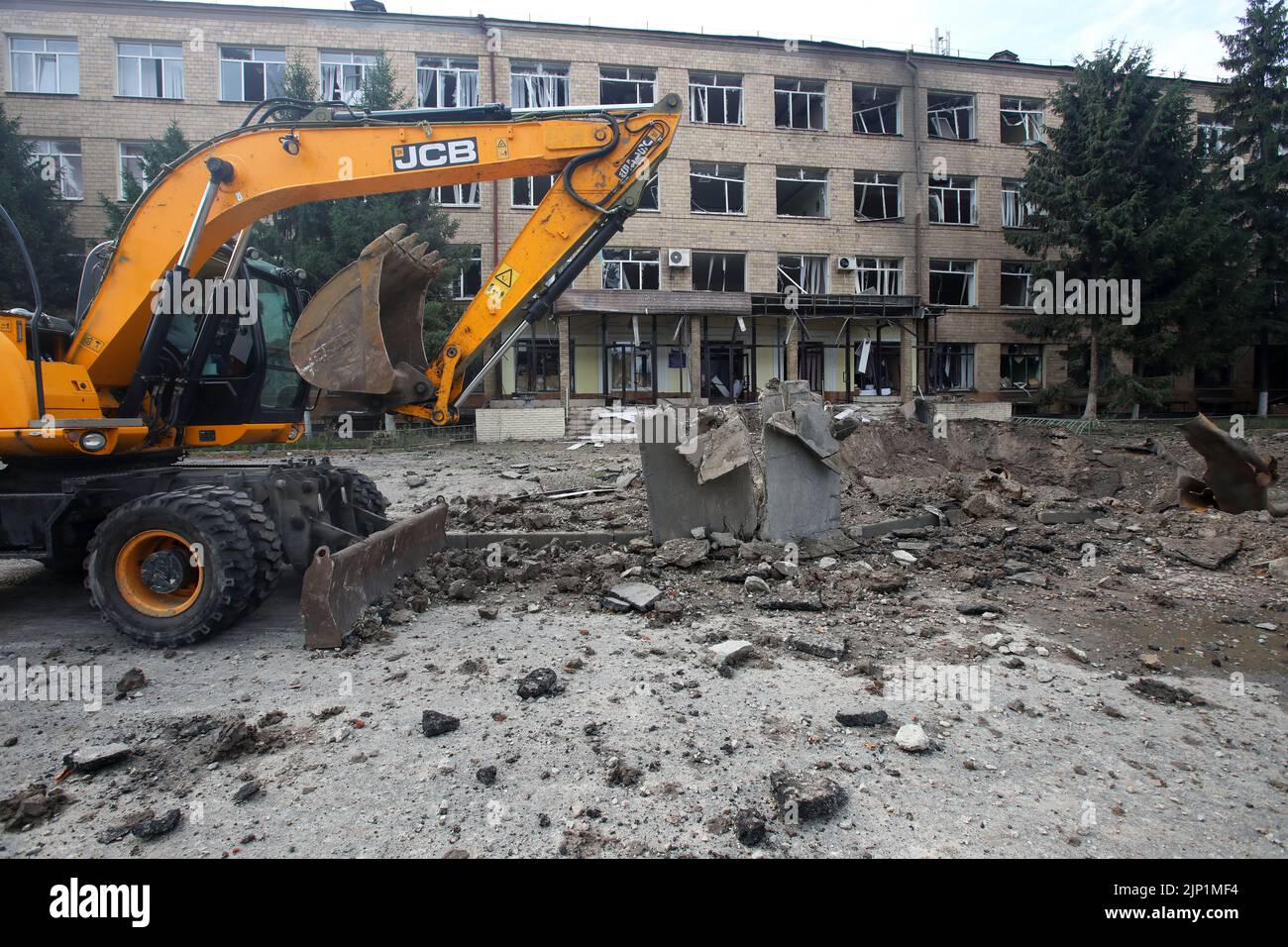 KHARKIV, UKRAINE - AUGUST 13, 2022 - An excavator is seen next to the ...