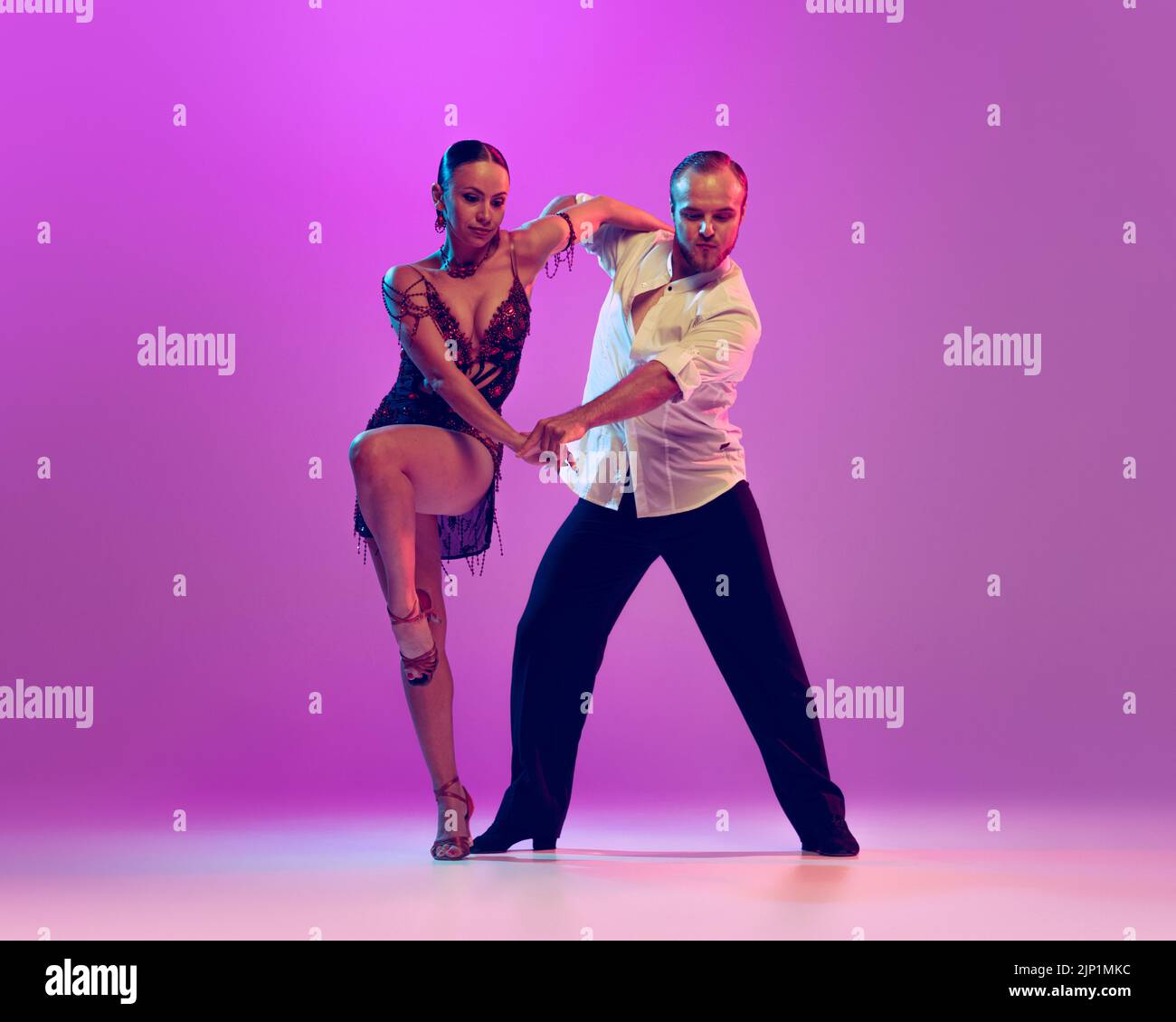 Beautiful coupleof dancers in adorable attires dancing ballroom dance ...