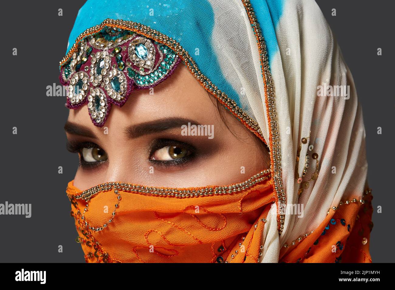 Studio shot of a chrming female wearing the colorful hijab decorated ...